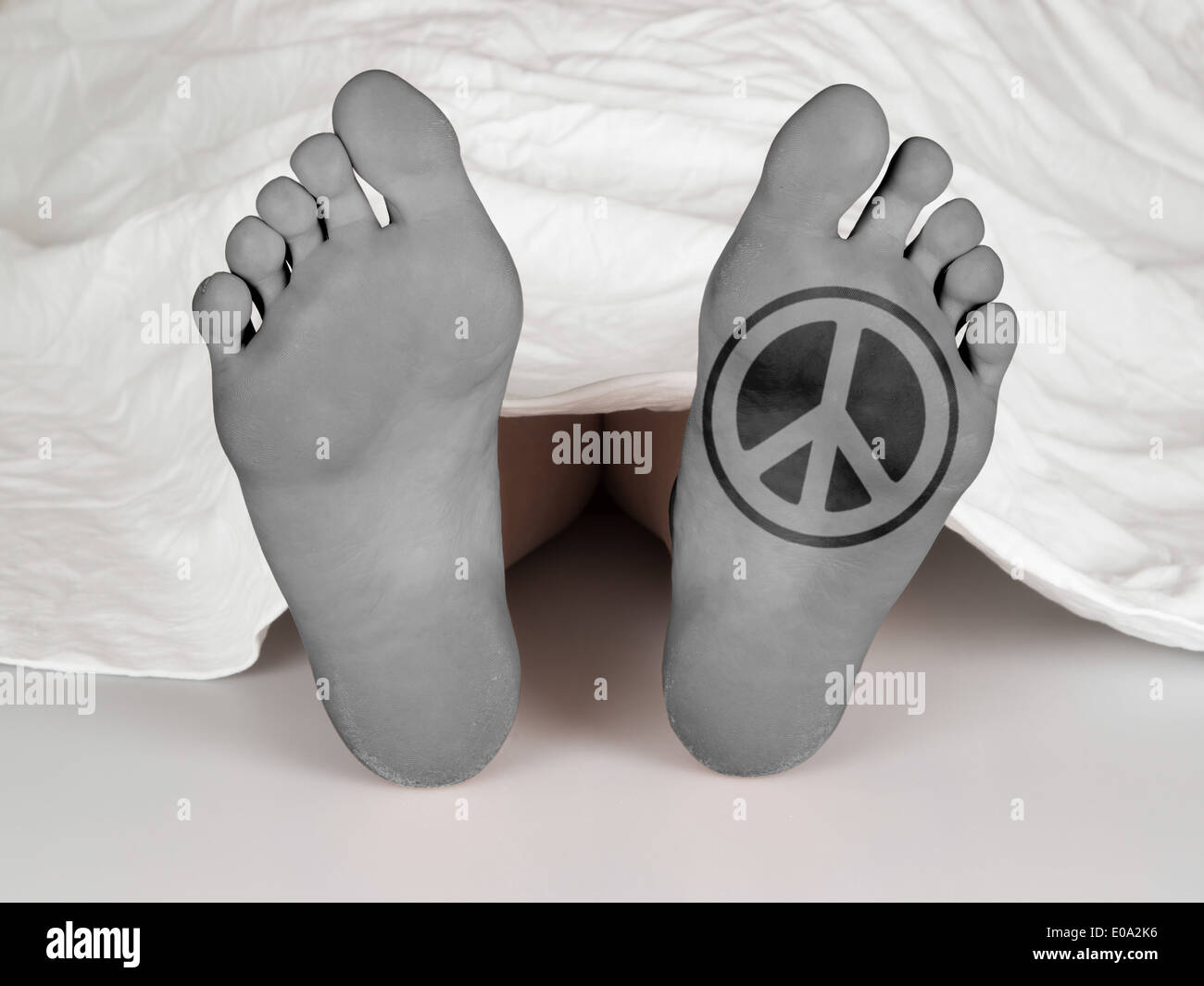 Dead body under a white sheet concept of sleeping or death peace symbol ...