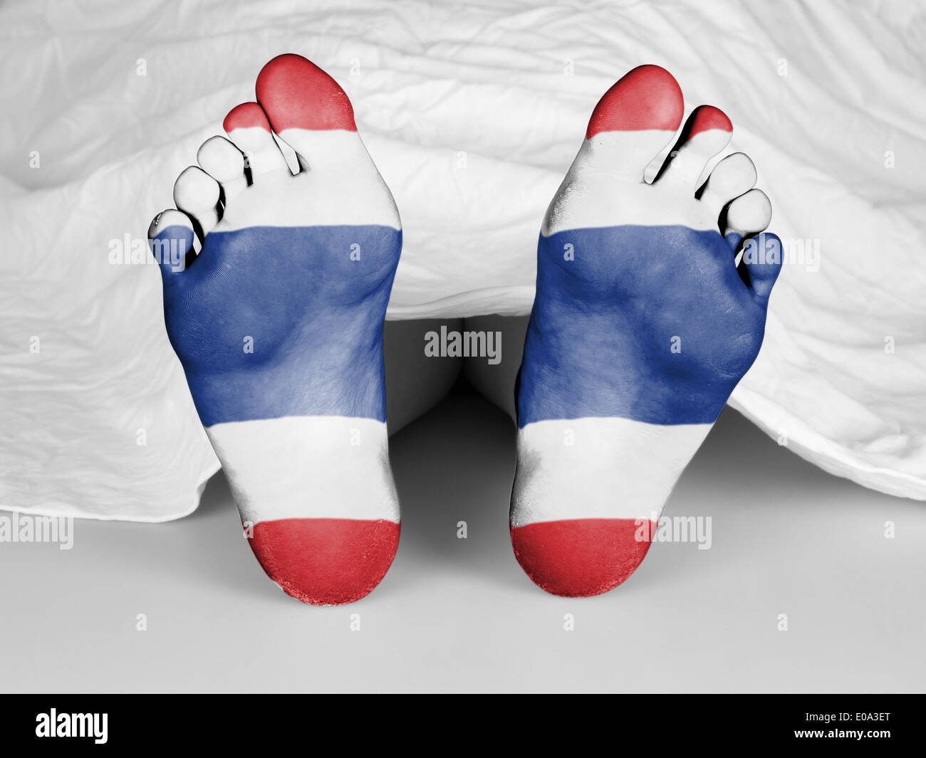 Dead body under a white sheet flag of Thailand Stock Photo - Alamy