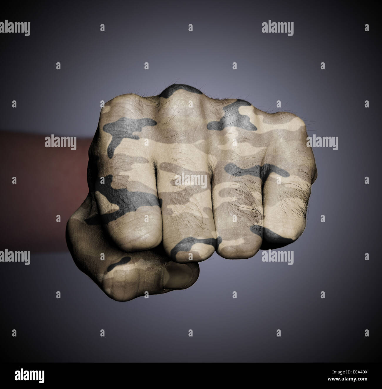 Front view of punching fist on gray background camouflage Stock Photo ...