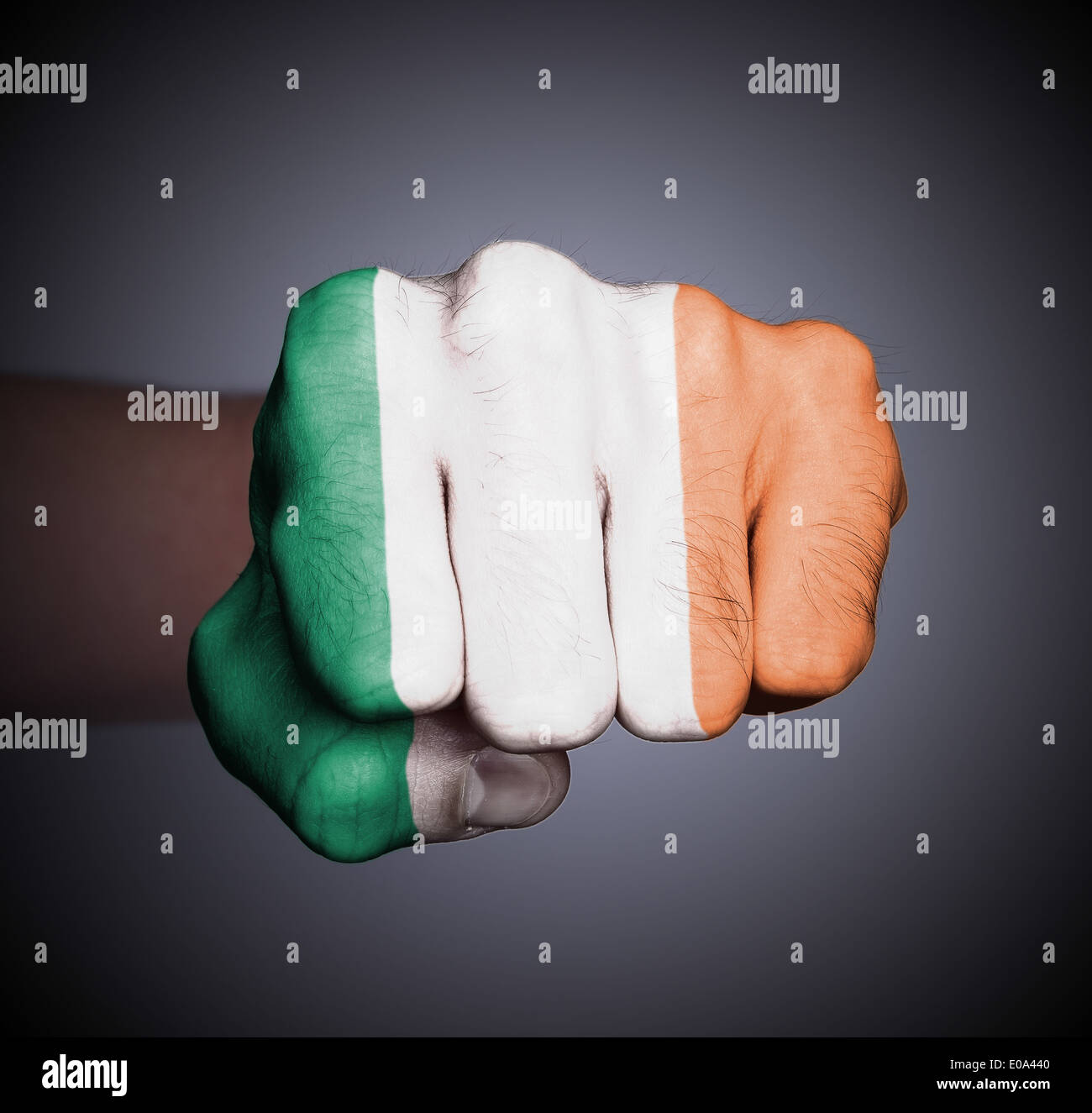 Front view of punching fist on gray background flag of Ireland Stock ...