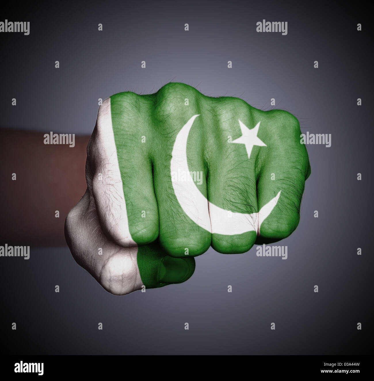 Front view of punching fist on gray background flag of Pakistan Stock ...