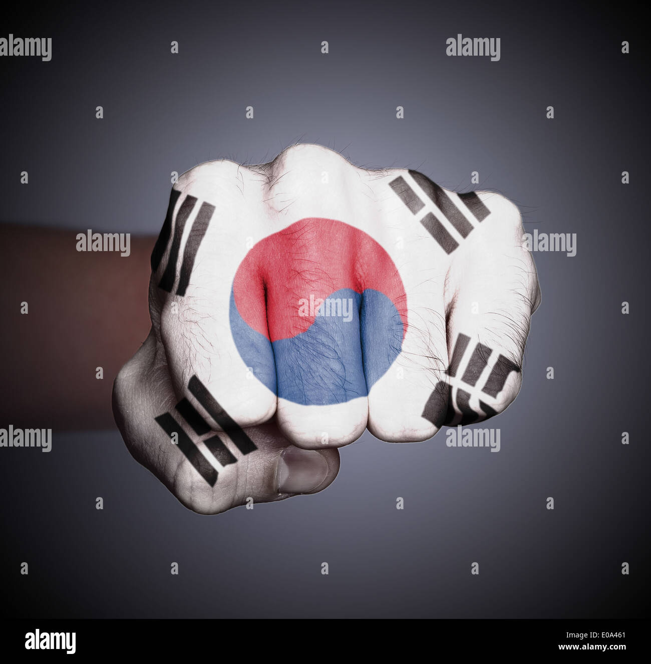Front view of punching fist on gray background flag of South Korea ...