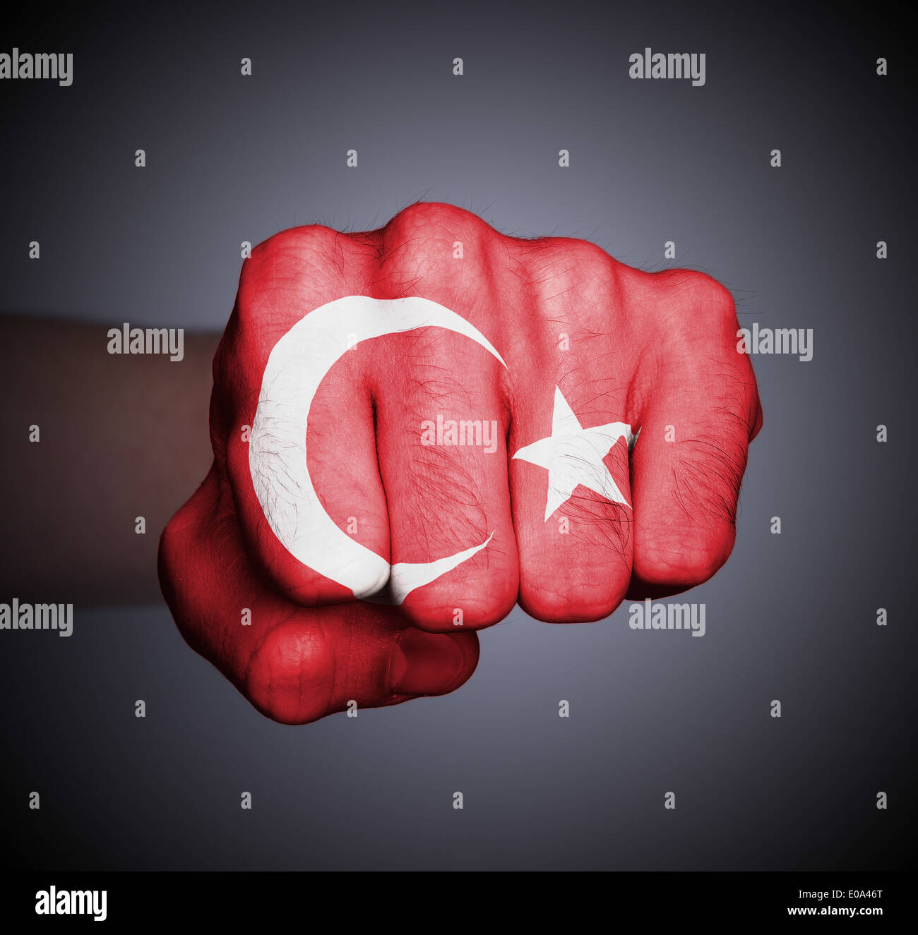 Front view of punching fist on gray background flag of Turkey Stock ...