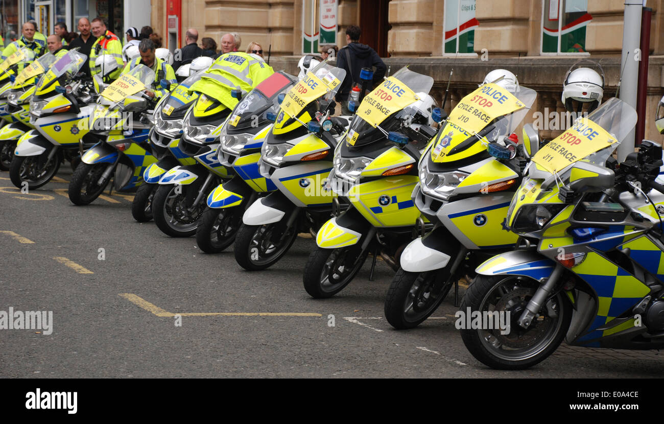 a line of police motorcycles at the 2014 womens cycling tour of Britain ...