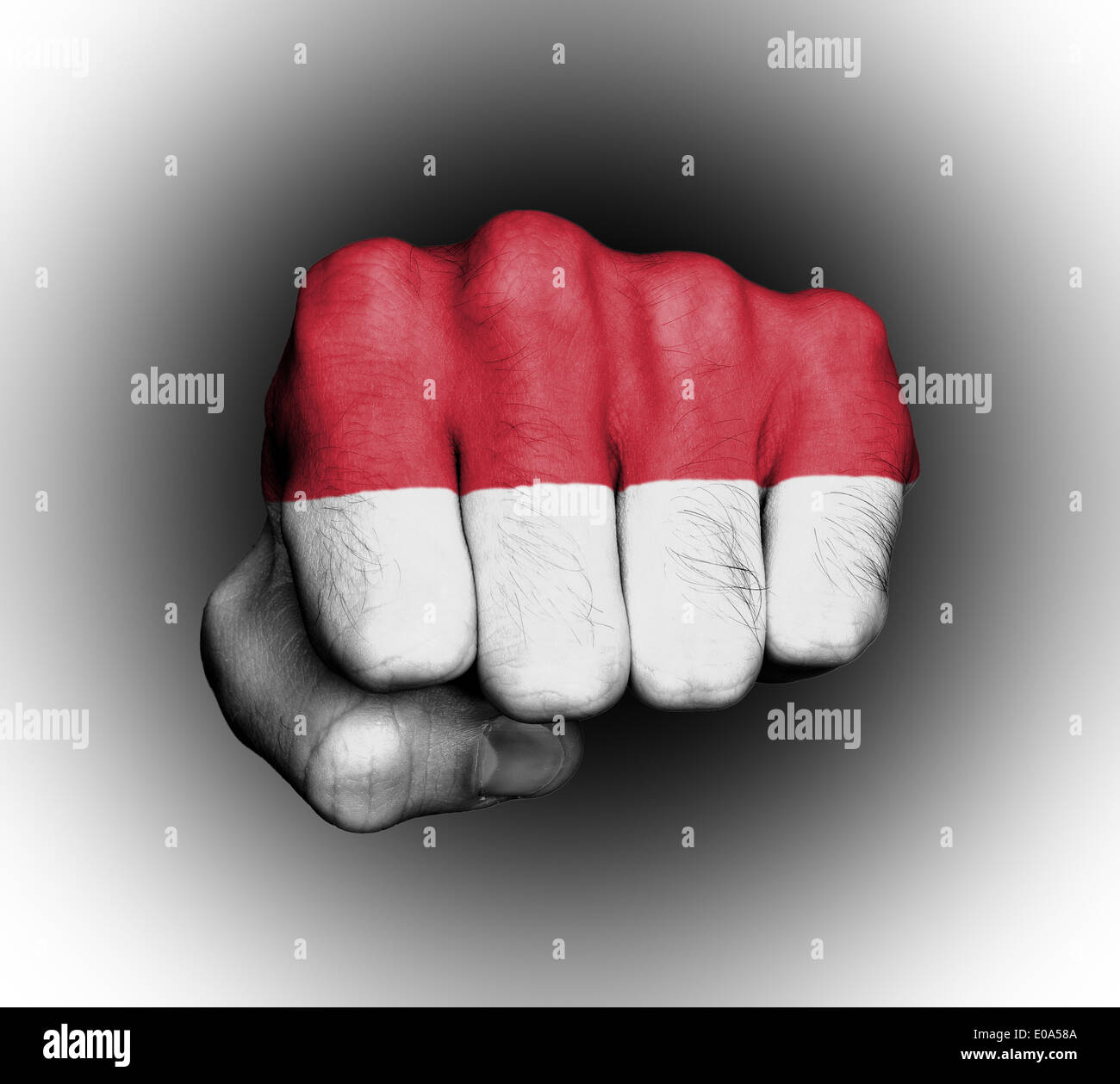 Fist of a man punching flag of Monaco Stock Photo - Alamy
