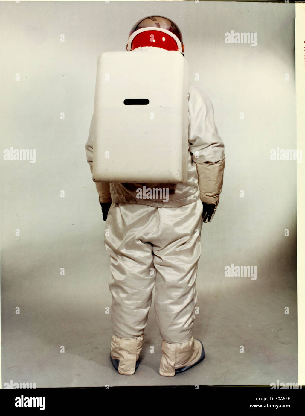This glossy photo features a NASA space suit, a critical part of ...