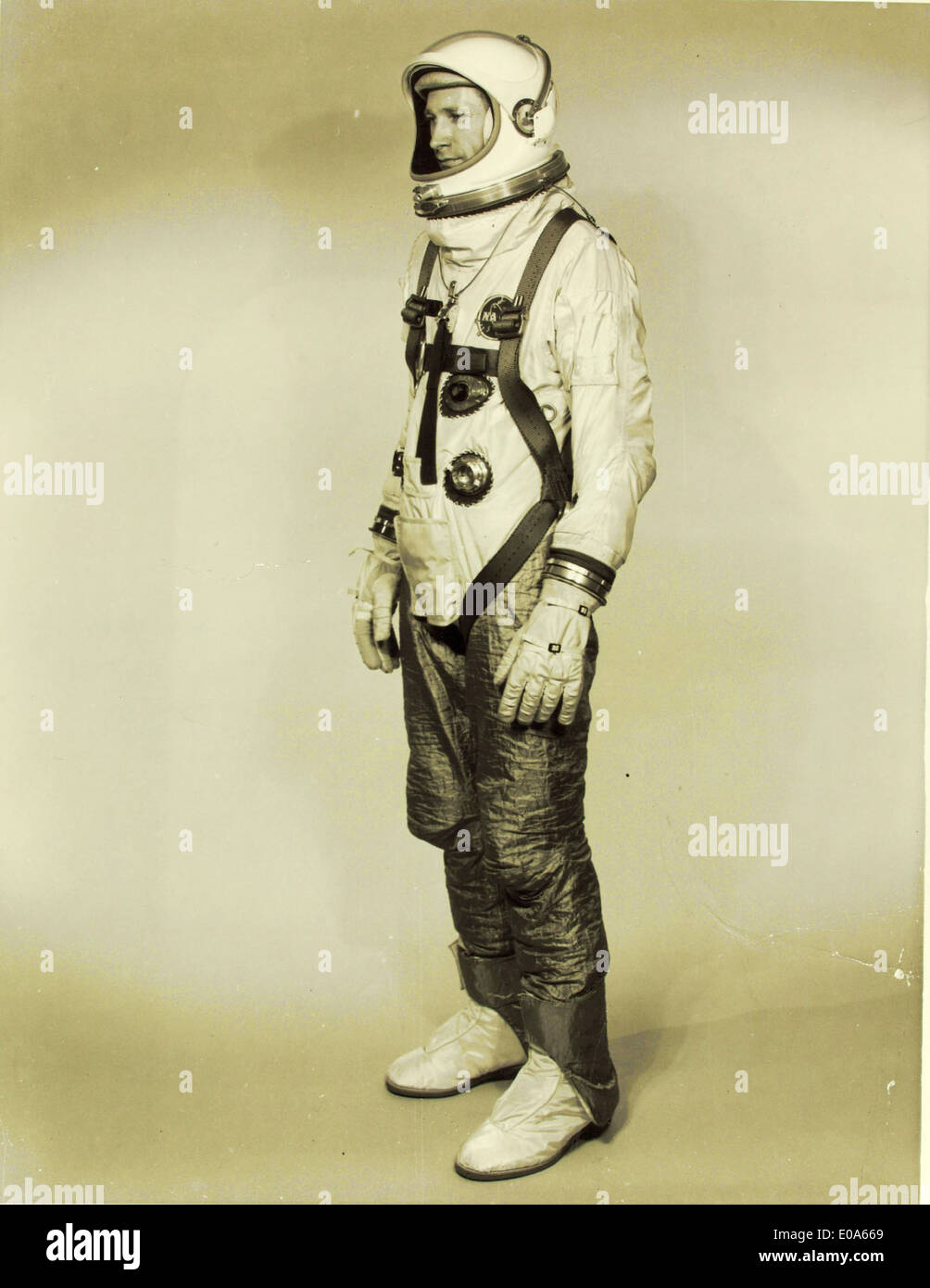 This glossy photo captures a NASA space suit, showcasing the essential ...