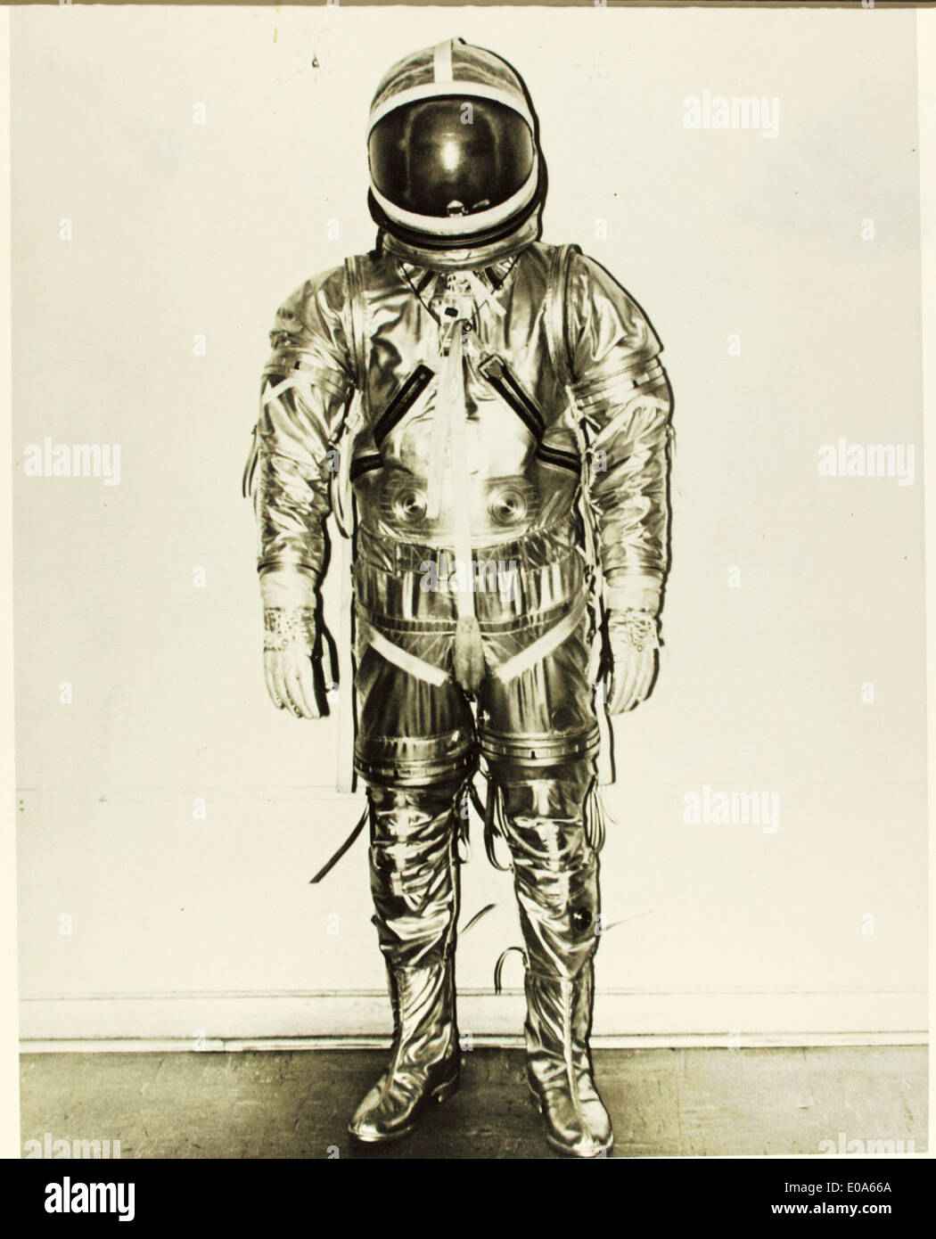This glossy photo showcases a NASA space suit, an essential component ...