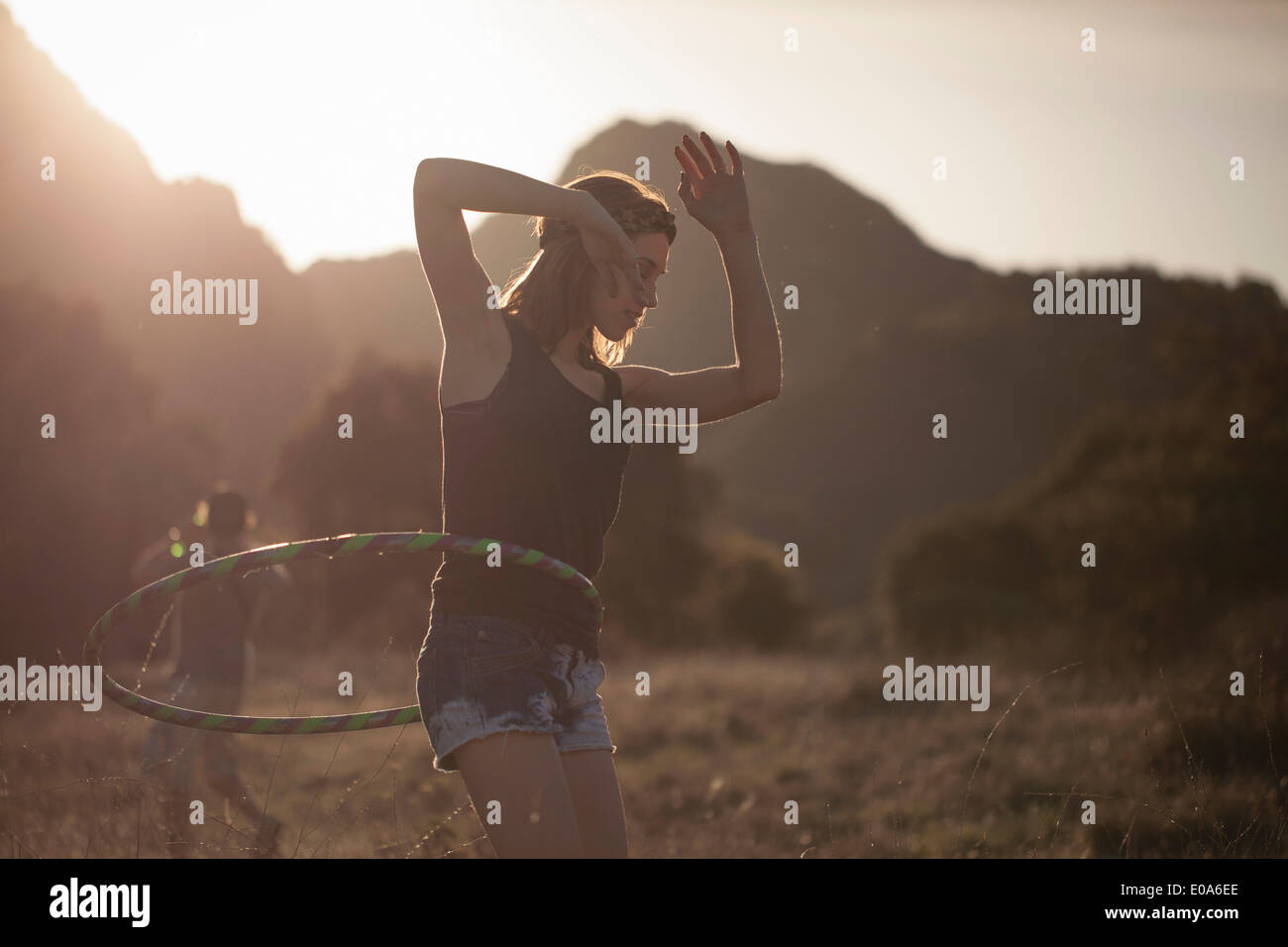Young woman performing with hoola hoop, Malibu Creek State Park ...