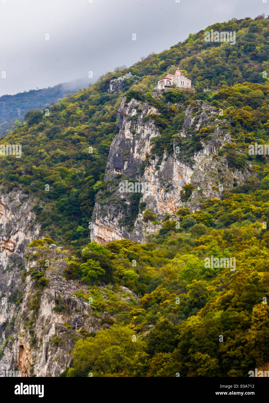 Greek orthodox church built at the edge of a cliff in Greece Stock ...