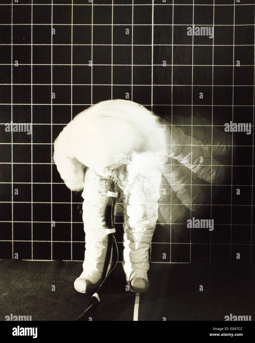 A glossy photograph of NASA space suits, highlighting the detailed ...