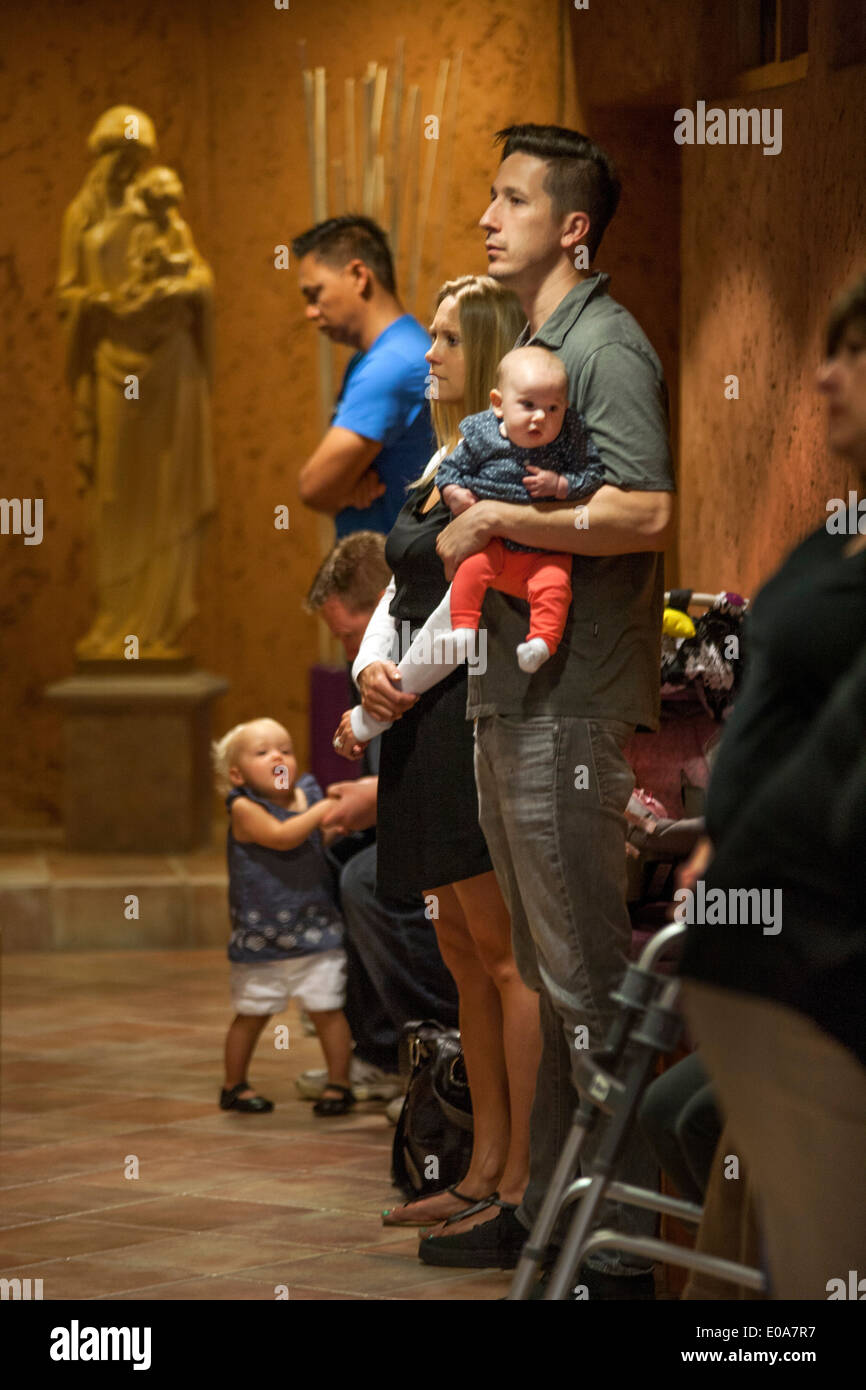 Family at catholic mass with kids hi-res stock photography and images ...