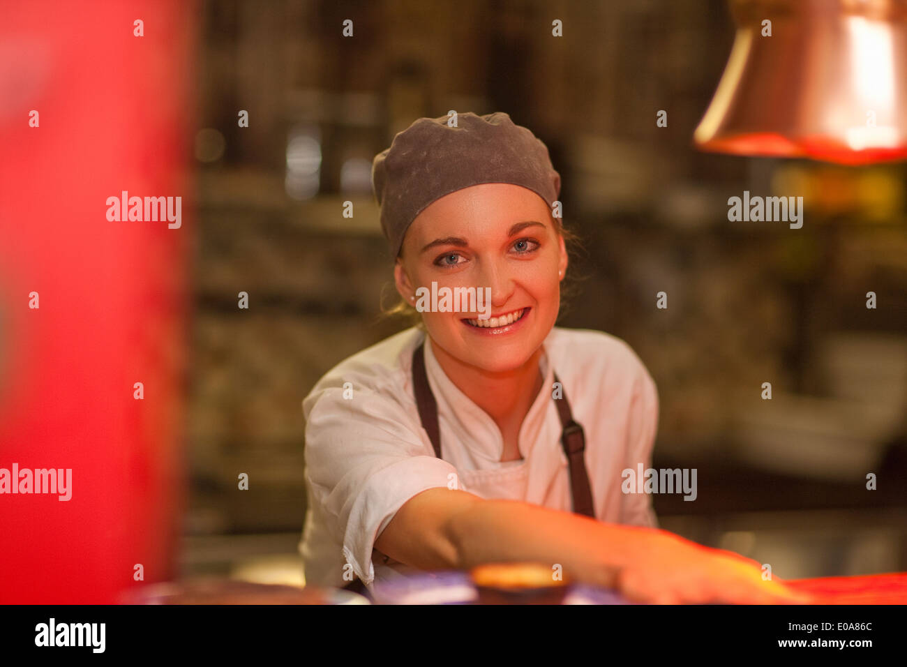 Leaning over counter hi-res stock photography and images - Alamy