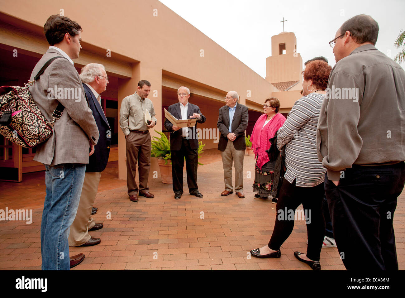 The deacon of a Catholic church meets with catechumens, or people ...