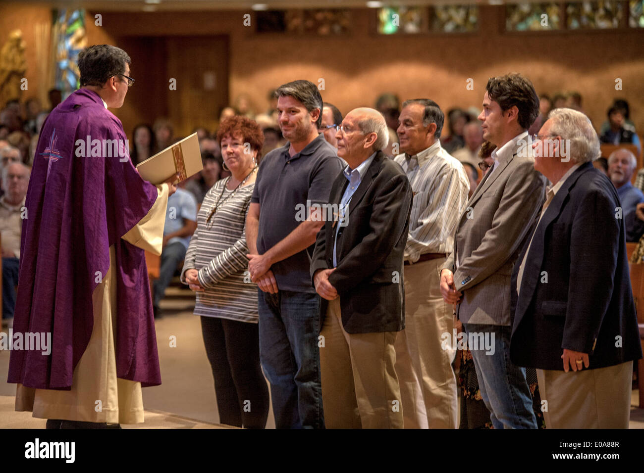 Catechumens, or people wishing to become Catholics, meet with their ...