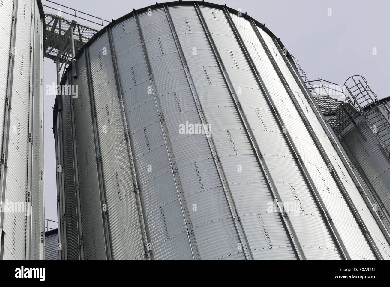 Detail of silver silos in port Stock Photo - Alamy