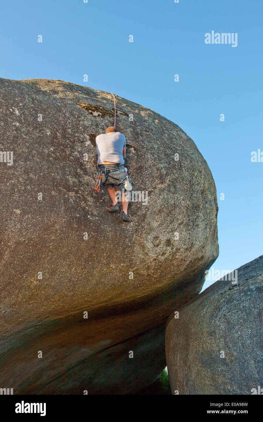 Man holding onto rope hi-res stock photography and images - Alamy