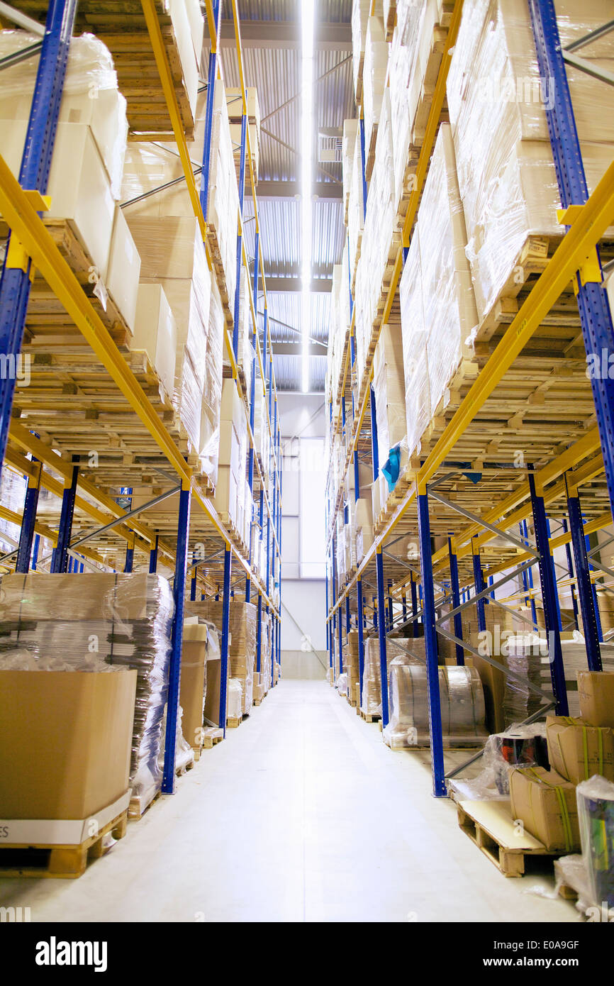 Aisle and shelves in distribution warehouse Stock Photo - Alamy