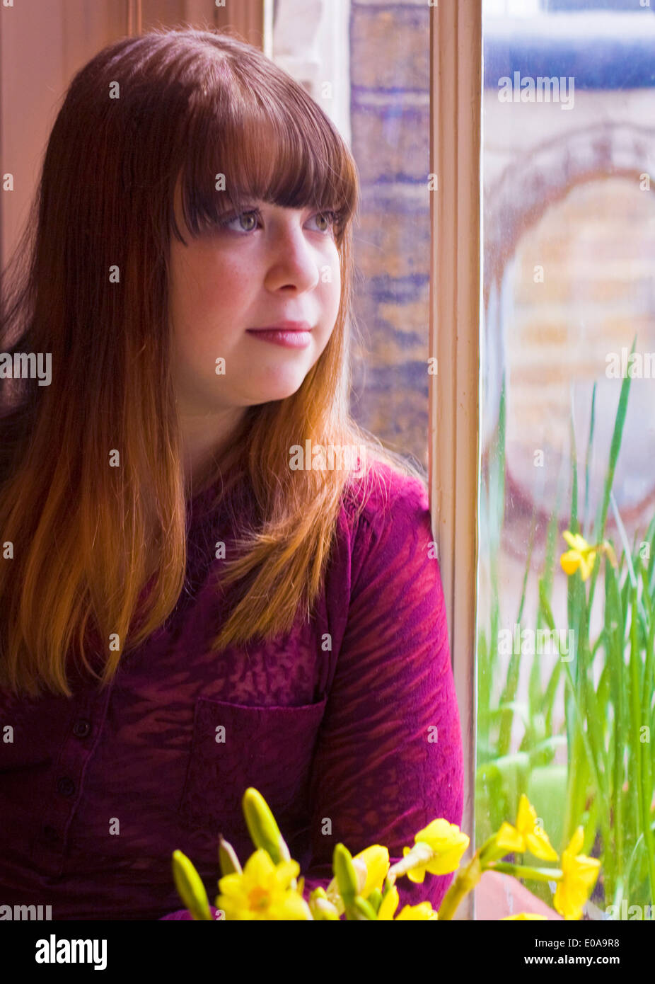 Portrait of girl by window Stock Photo - Alamy