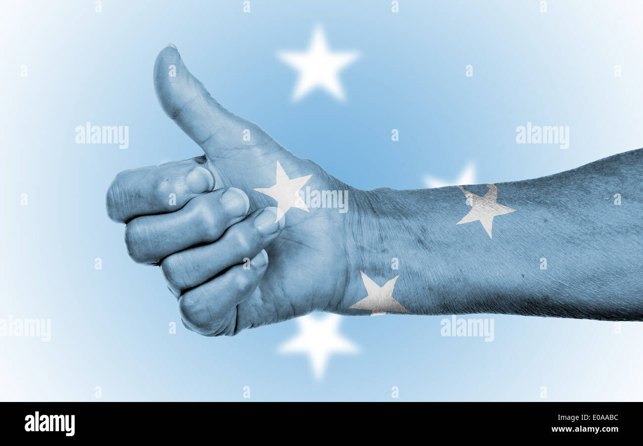 Old woman giving the thumbs up sign isolated flag of Micronesia Stock ...