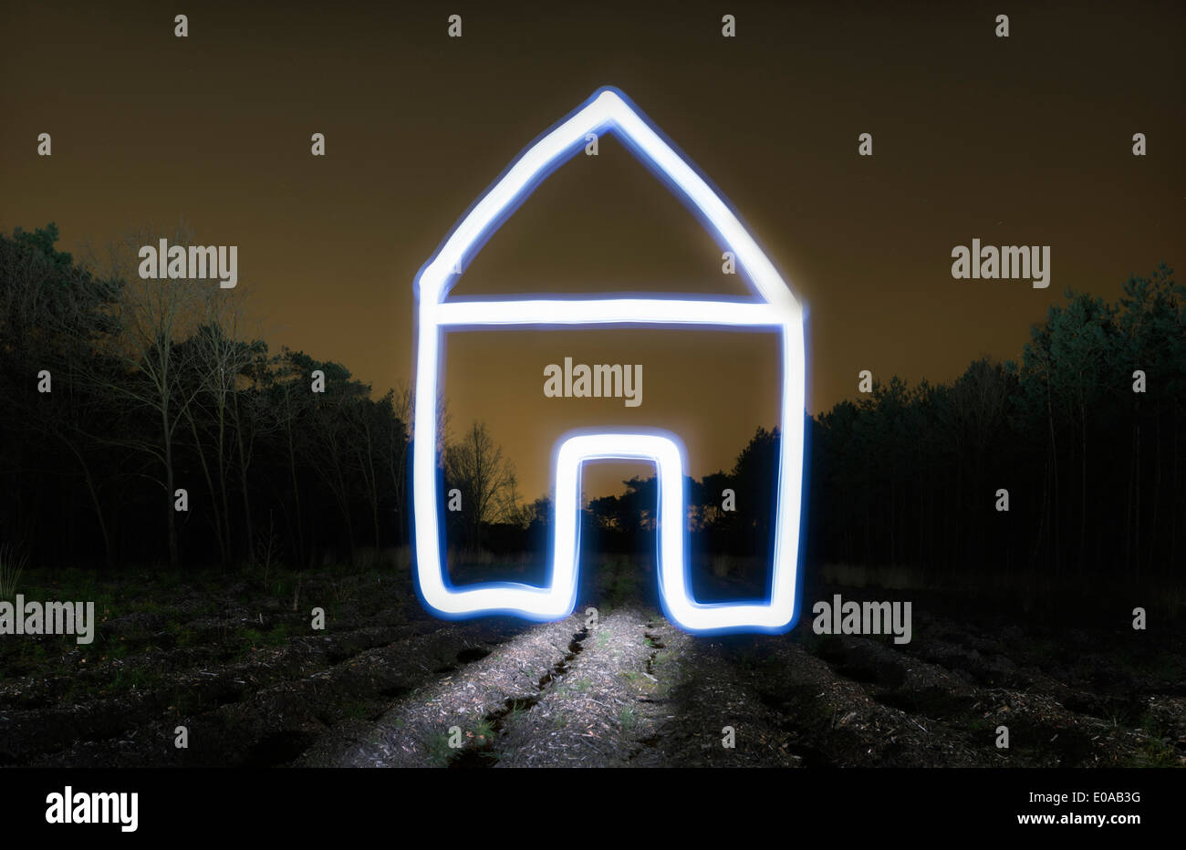 Field landscape at night with light painted drawing of house Stock ...