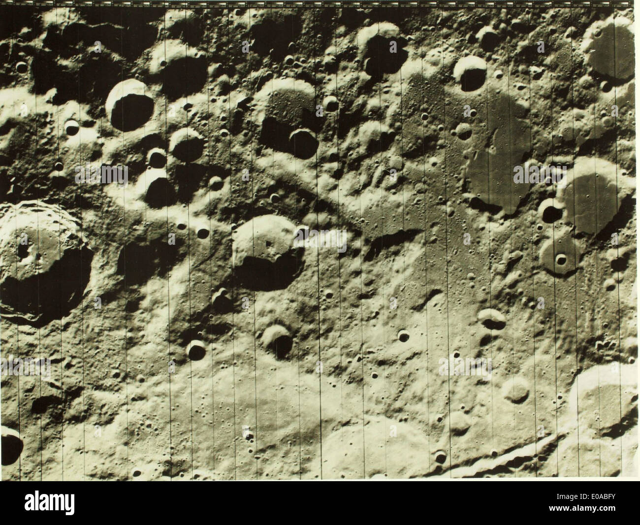 This glossy photograph from NASA captures the Moon's surface during a ...
