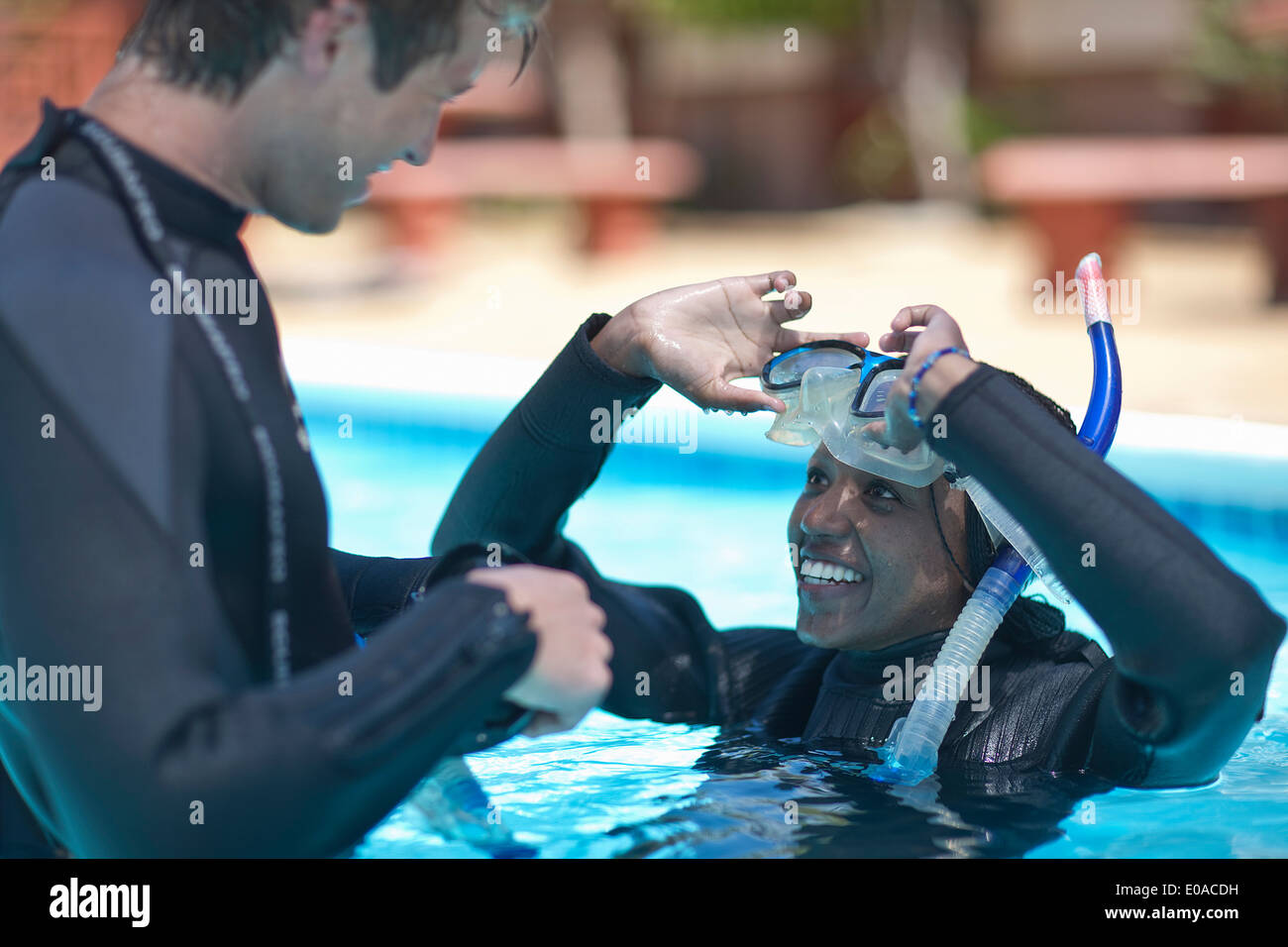 Scuba diving instructor with female pupil in swimming pool Stock Photo ... Scuba diving instructor with female pupil in swimming pool Stock Photo ...