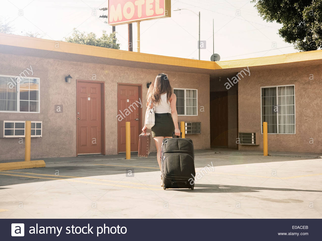 Pulling Woman On Suitcase Stock Photos & Pulling Woman On Suitcase ...