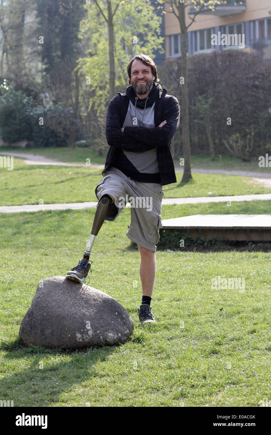 Portrait of man with prosthesis leg in park Stock Photo - Alamy