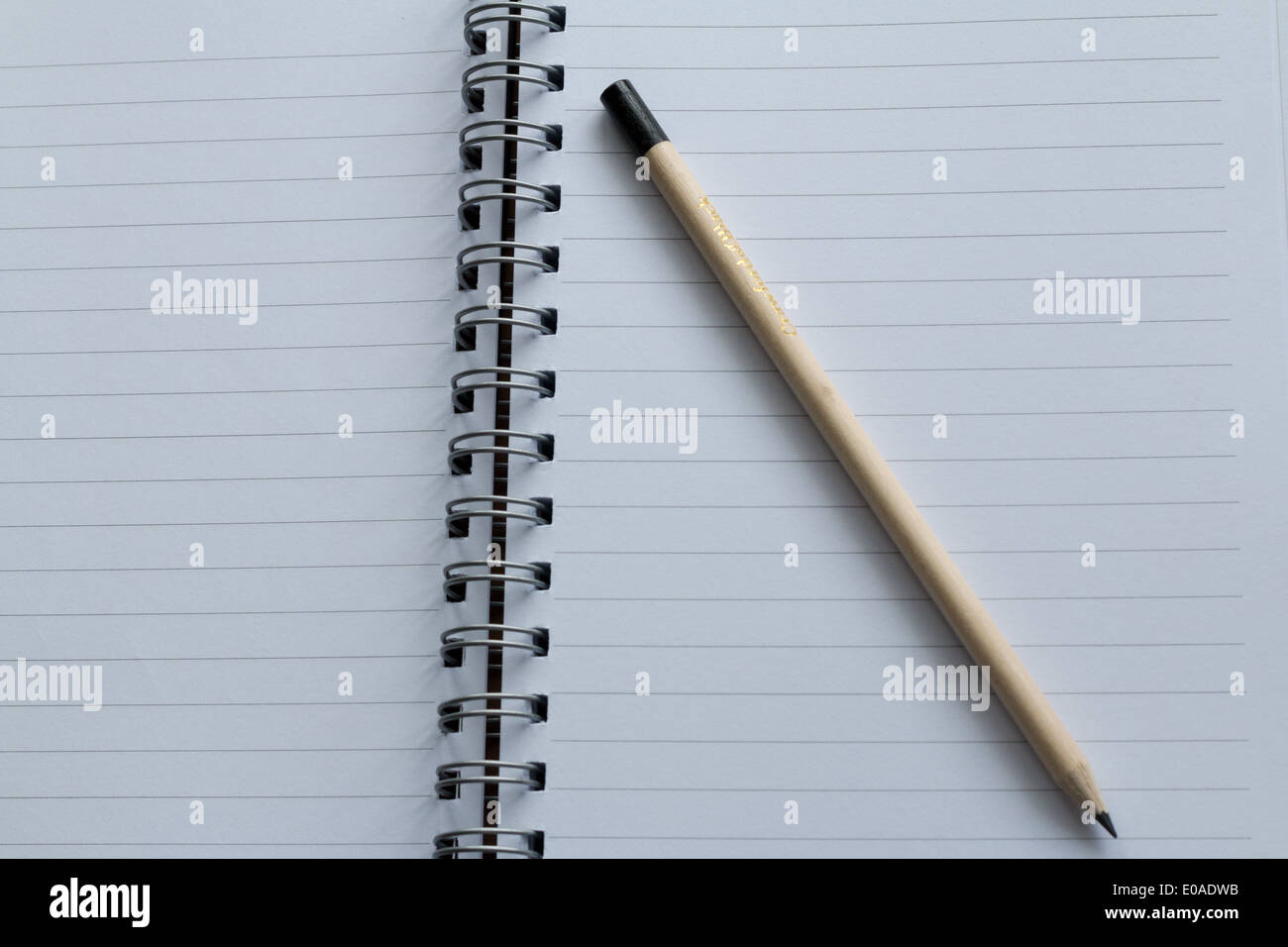 Open notebook on desk with a pencil Stock Photo - Alamy