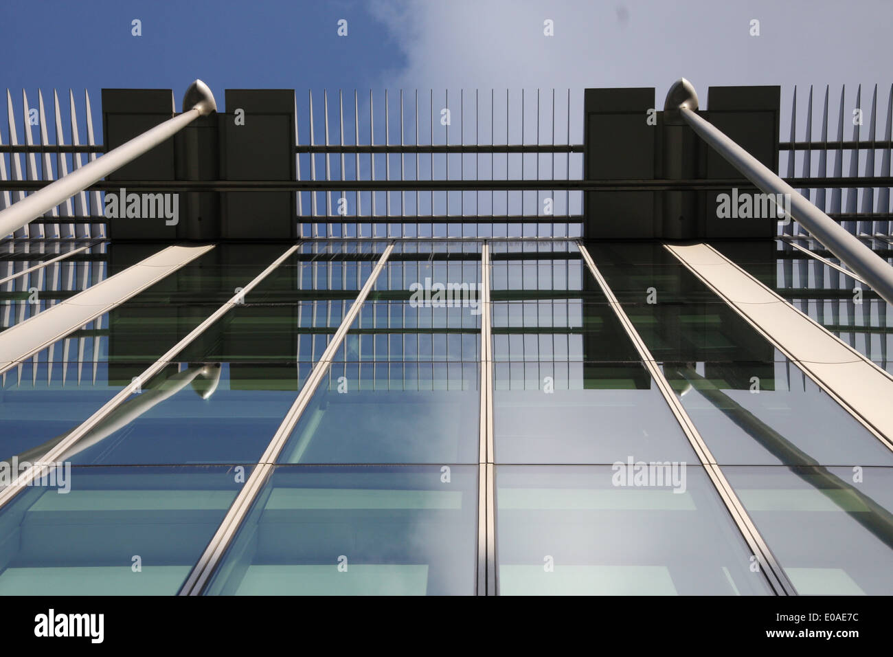 glass building with spikes, looking up to blue sky with cloud Stock ...