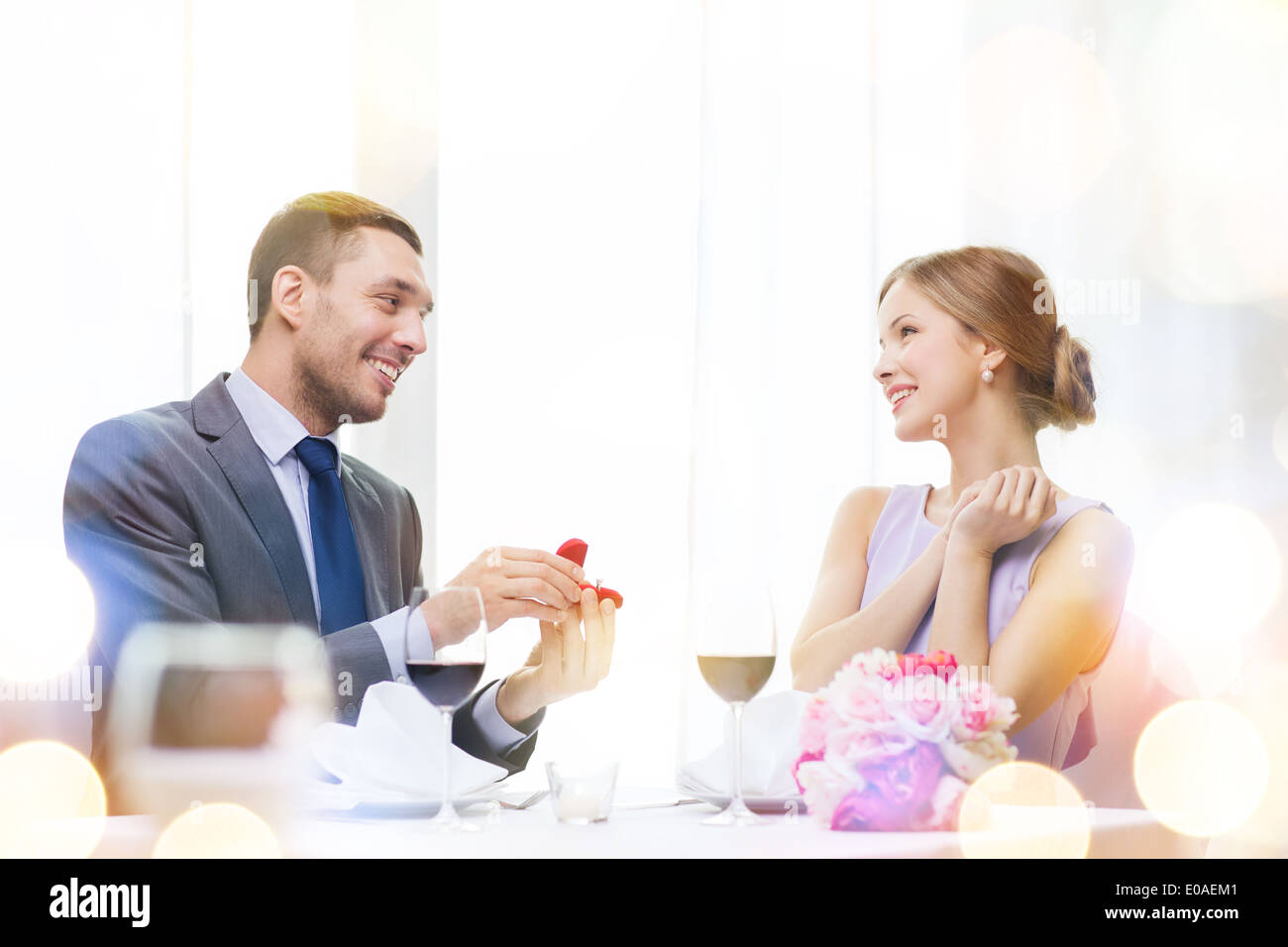 man proposing to his girlfriend at restaurant Stock Photo - Alamy