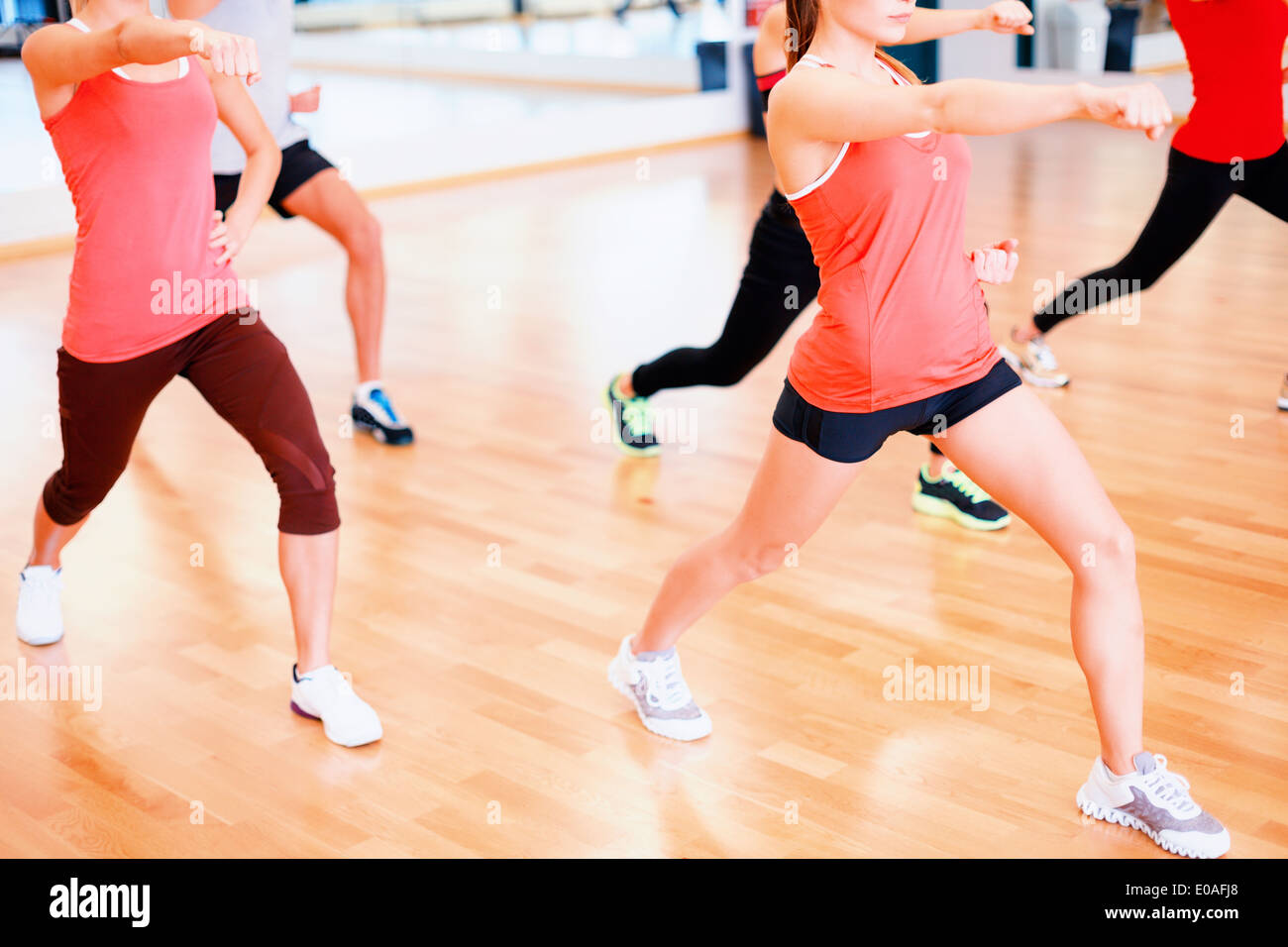 group of smiling people exercising in the gym Stock Photo - Alamy