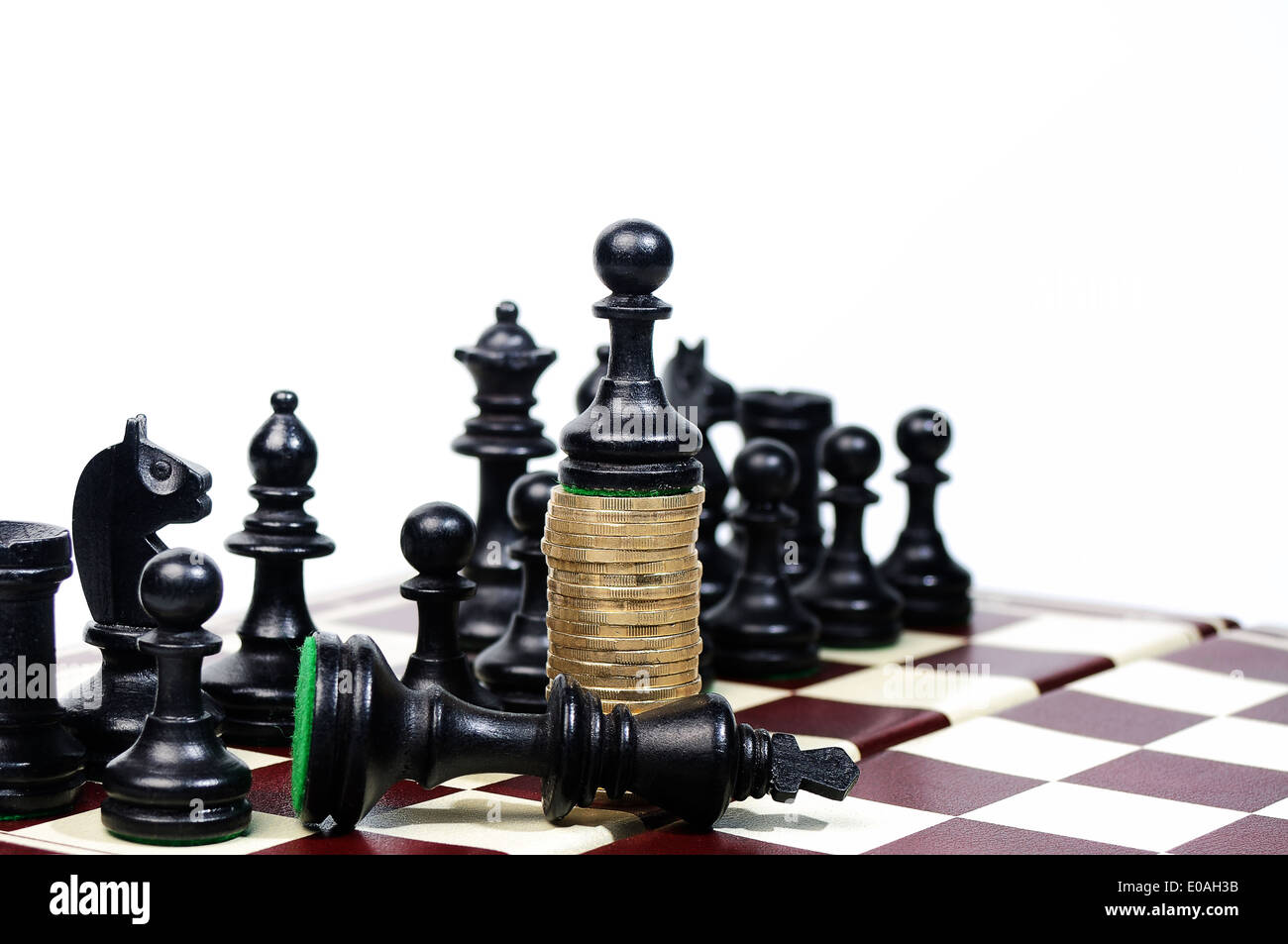 power of the money concept. Chess paun standing on the money wining the ...