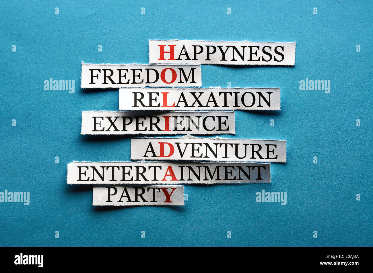 holiday acronym in business concept, words on cut paper hard light ...