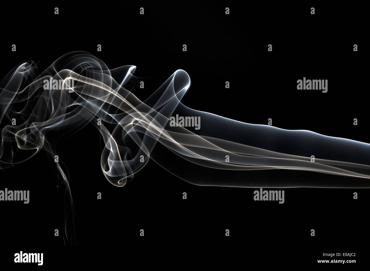 Abstract smoke pattern isolated on black background Stock Photo - Alamy