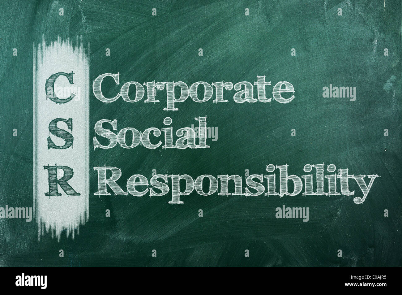 corporate social responsibility ( CSR ) concept on green chalkboard ...
