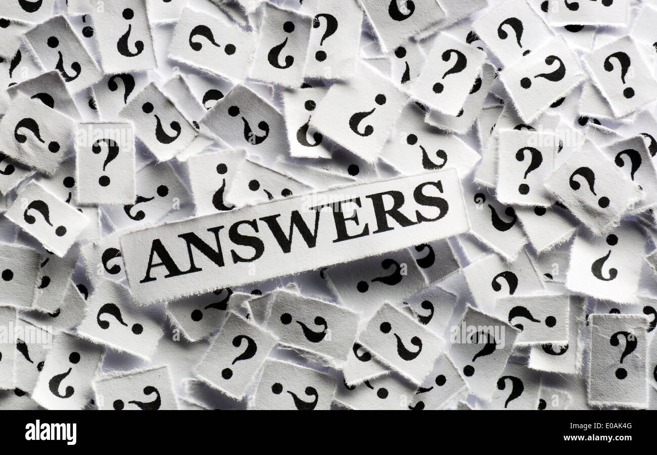 answers question marks on white papers -hard light Stock Photo - Alamy