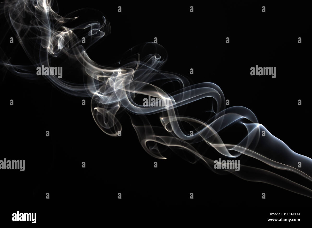 Abstract smoke pattern isolated on black background Stock Photo - Alamy