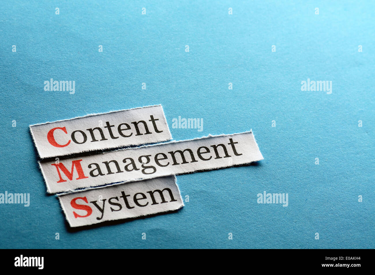 CMS Content Management System abbreviation on blue paper Stock Photo ...