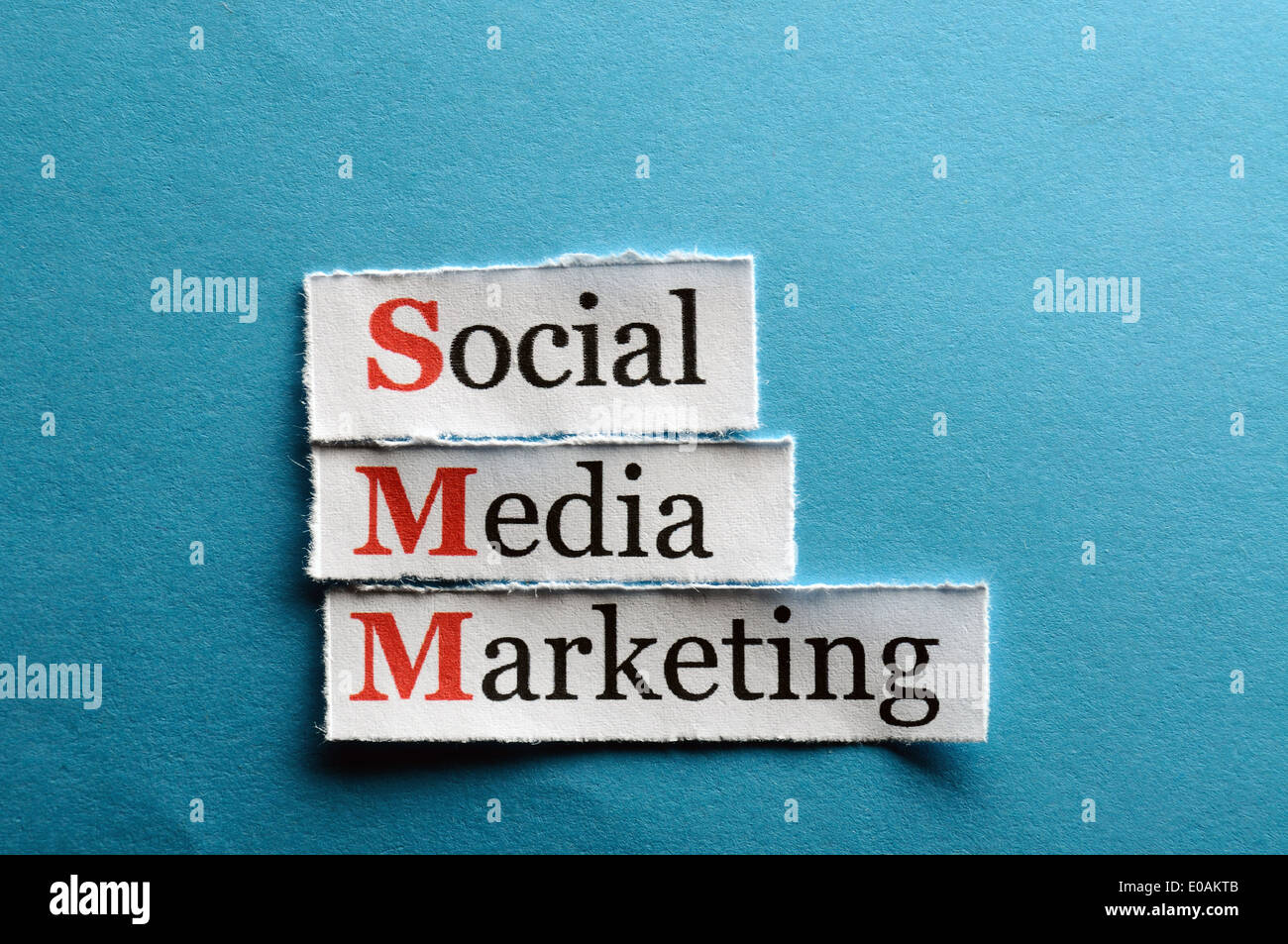 SMM - Social Media Marketing on blue paper Stock Photo - Alamy