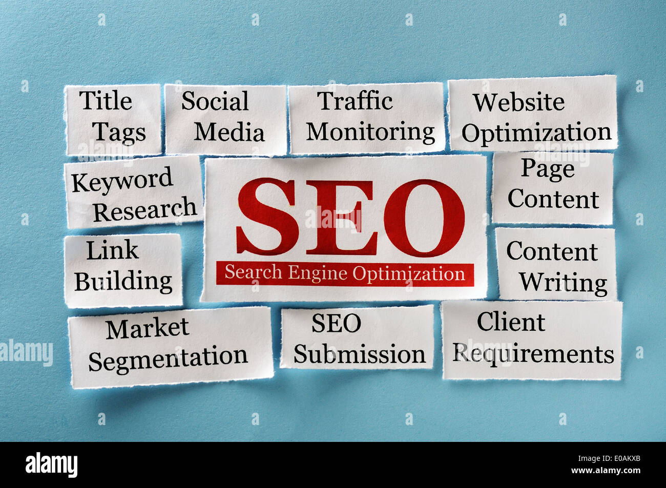 SEO Word Cloud printed on paper on blue font Stock Photo - Alamy
