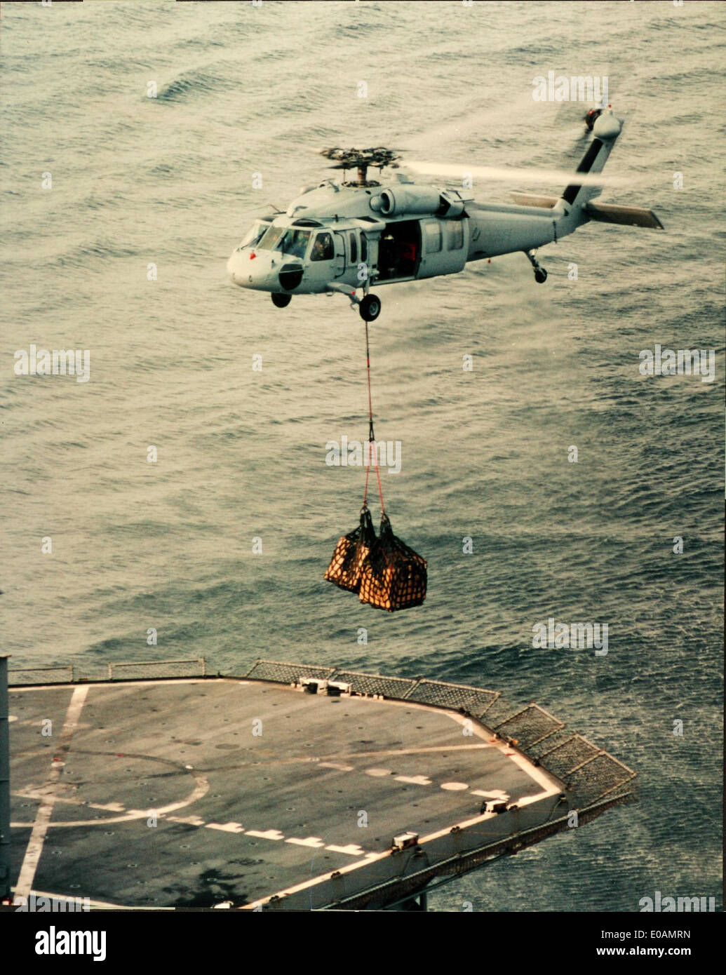 This image shows a CH-60 Seahawk helicopter during a vertical ...