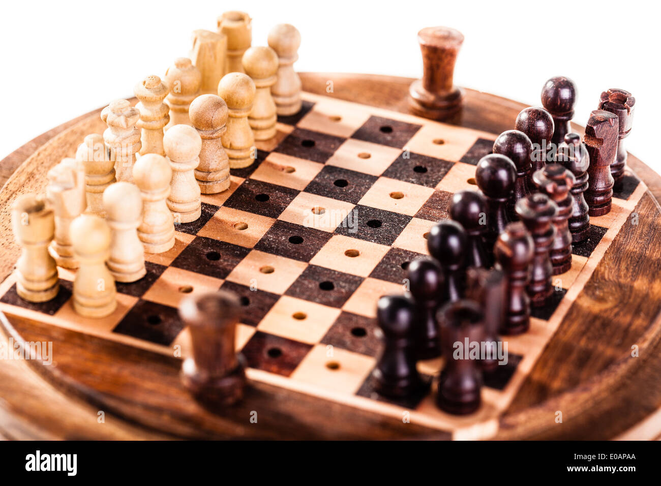 a small wooden chess board with chess pieces isolated over white Stock ...