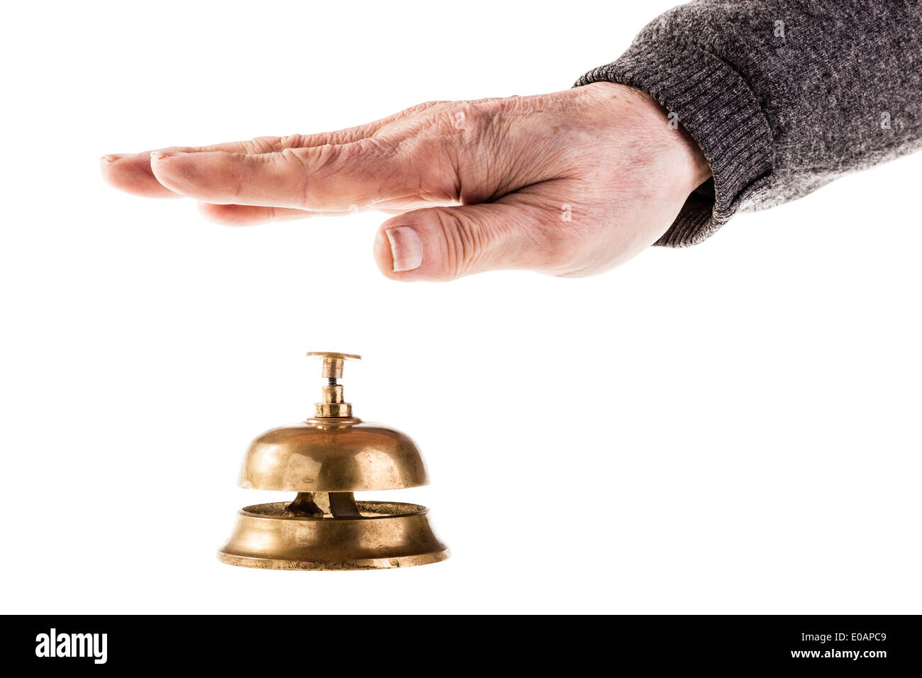 a mature old man ringing a hoted reception bell isolated over white ...