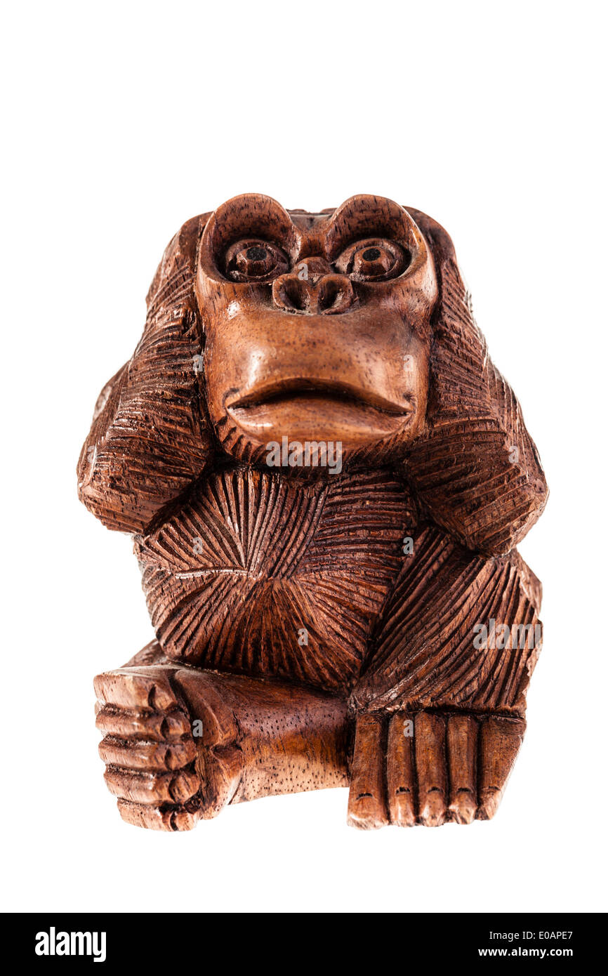 a wooden monkey sculpture isolated over a white background Stock Photo ...