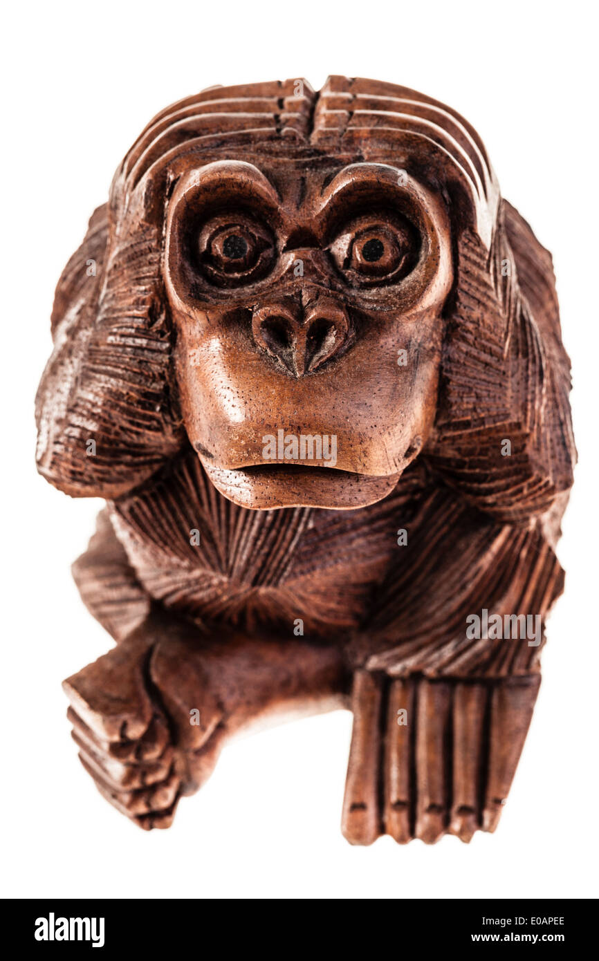 a wooden monkey sculpture isolated over a white background Stock Photo ...