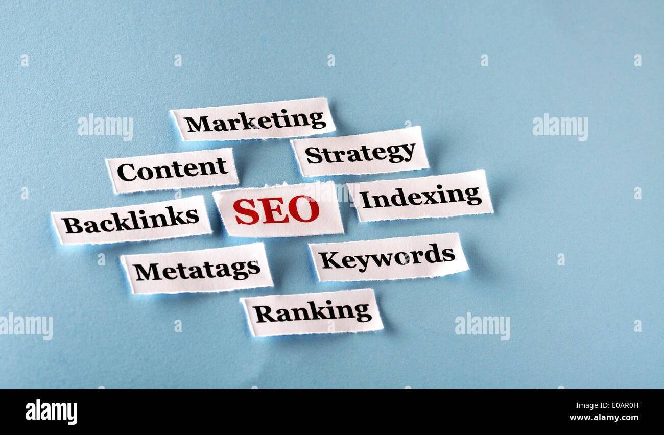 SEO Word Cloud printed on paper on blue Stock Photo - Alamy