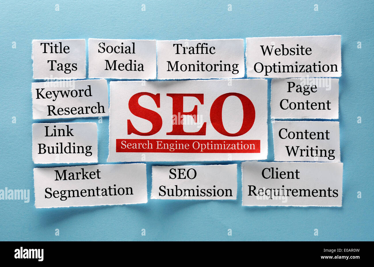 SEO Word Cloud printed on paper on blue Stock Photo - Alamy
