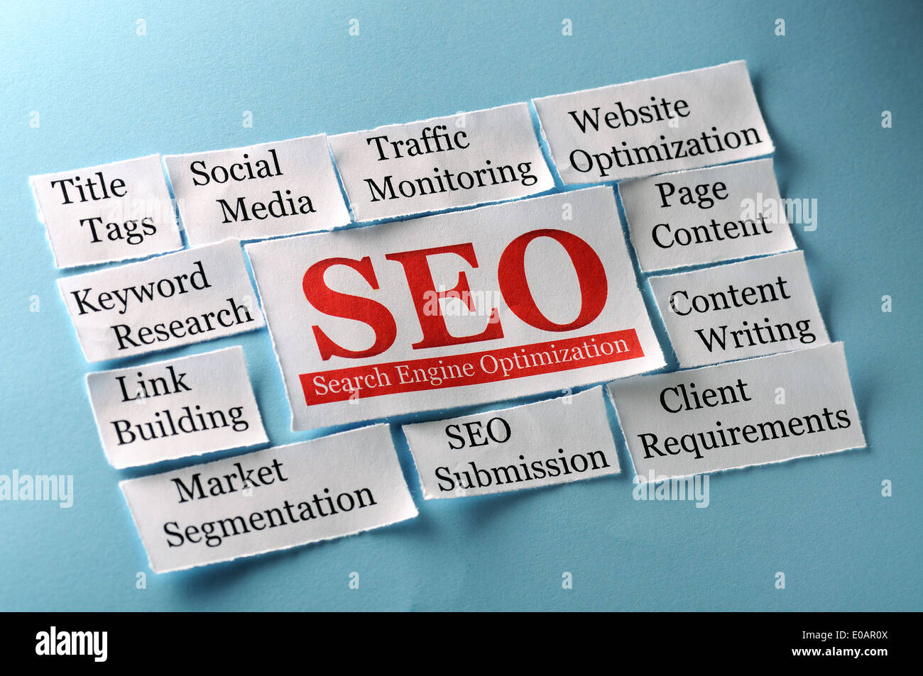 SEO Word Cloud printed on paper on blue Stock Photo - Alamy